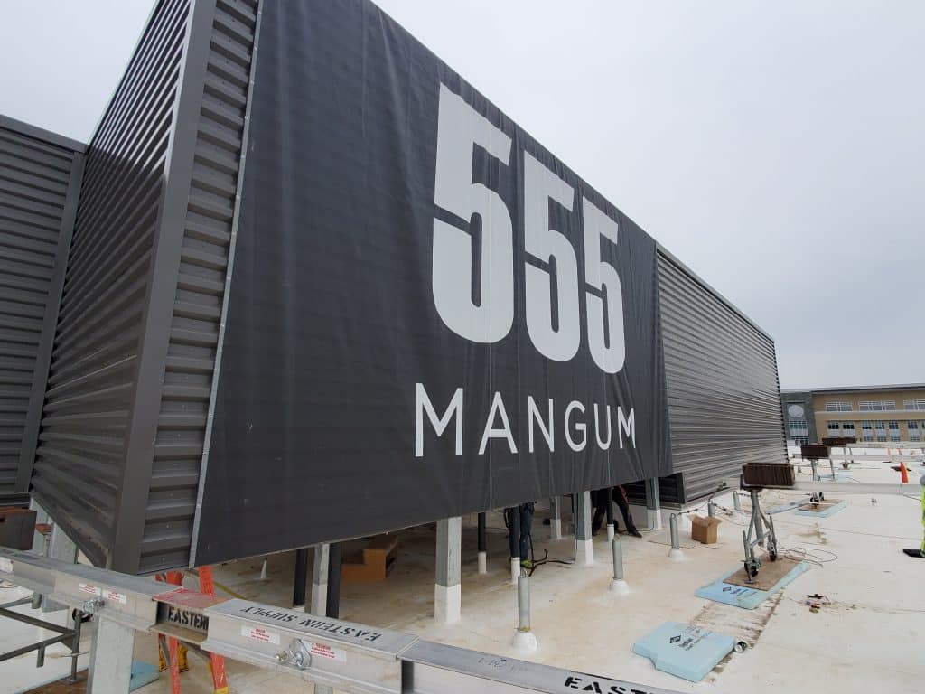 Elevate Your Brand with Mesh Building Wraps: The 555 Building ...